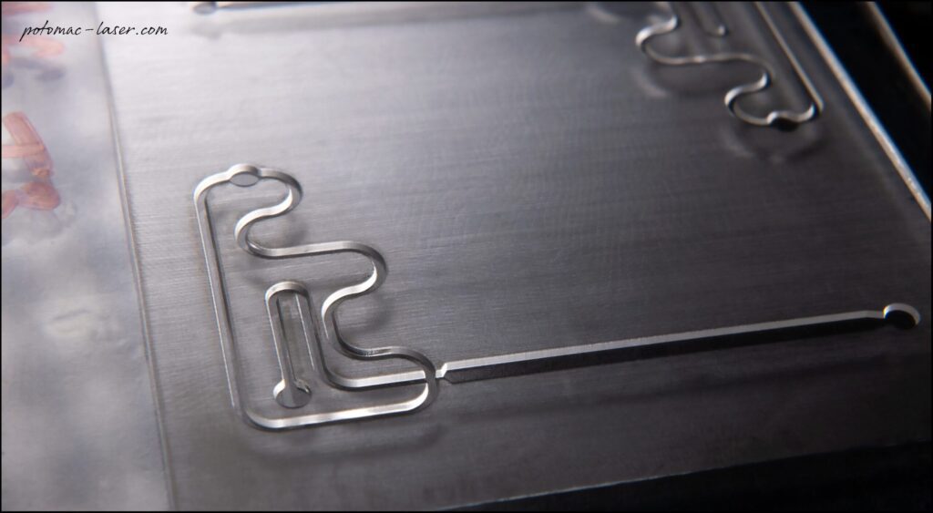 Laser Drilling of Port Holes for Microfluidic Devices | Potomac Photonics